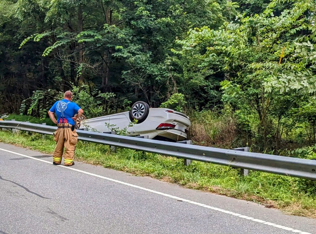 Car flips over guardrail - Sandhills Sentinel