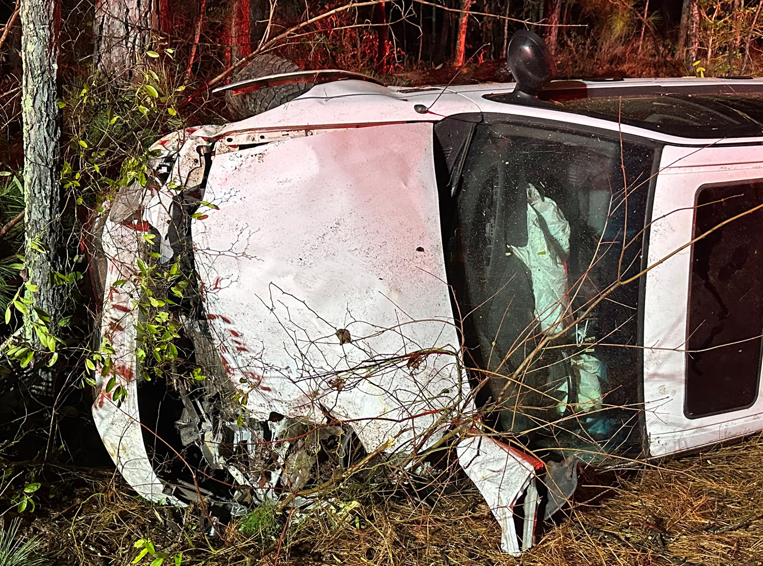 Driver climbs out of rolled-over pickup truck - Sandhills Sentinel